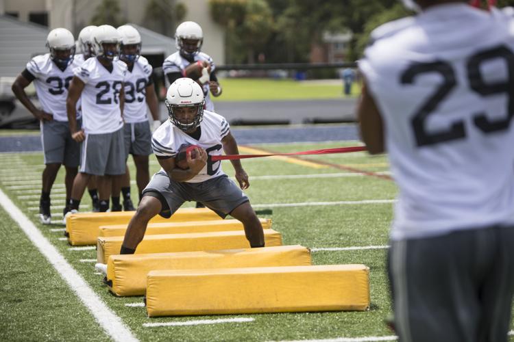 Curated playlists set the rhythm for each part of Citadel football practice