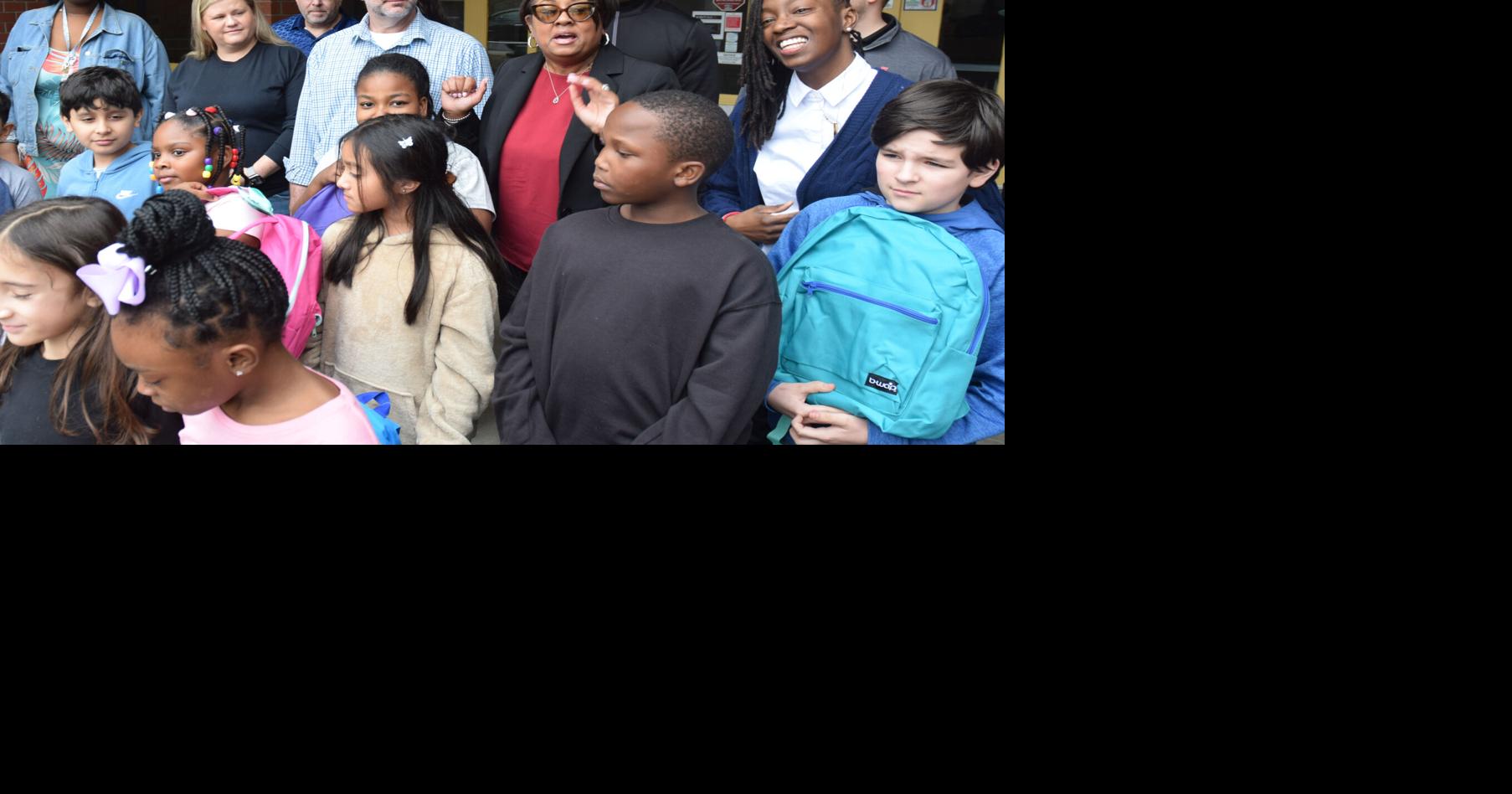 Owens Corning workers bring gifts for North Aiken Elementary