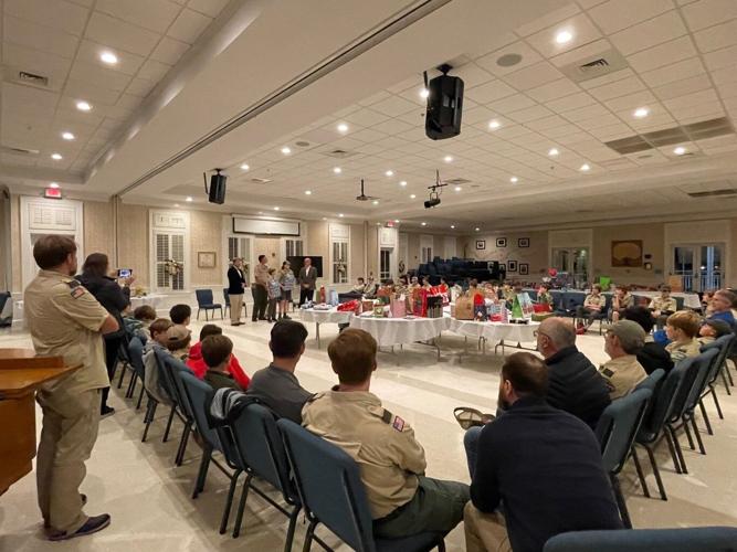 Two scouts receive laptops from Computers with a Cause