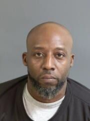 Police: Man charged in hotel murder left photo ID at crime scene