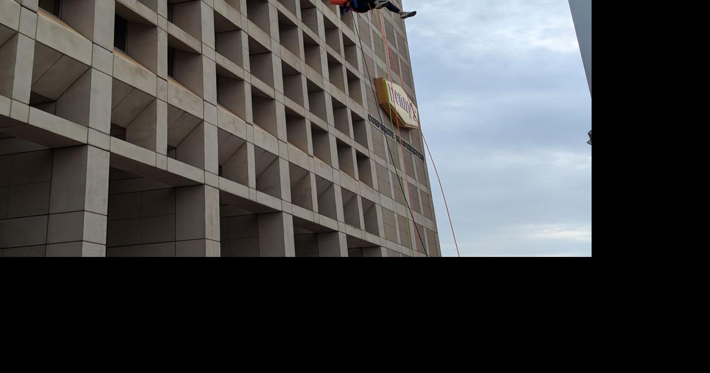 Rappelling down Spartanburg Denny's for Over the Edge event