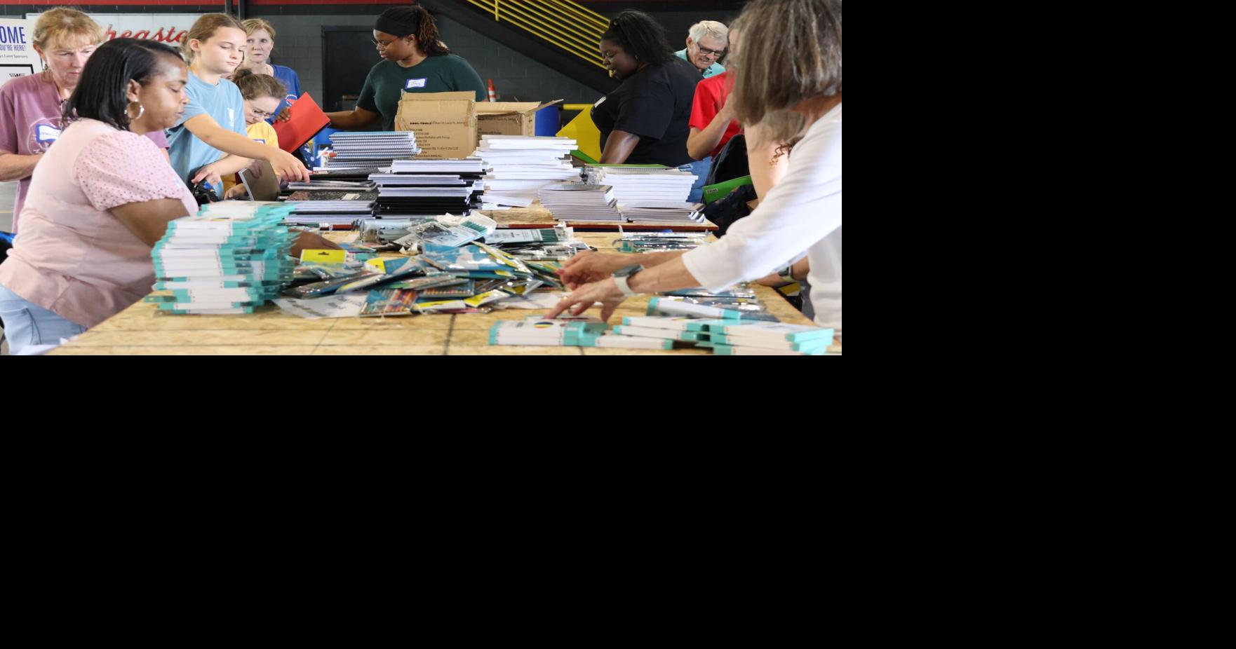 Volunteers pack 2,000 backpacks at 'Ready, Set, Thrive'