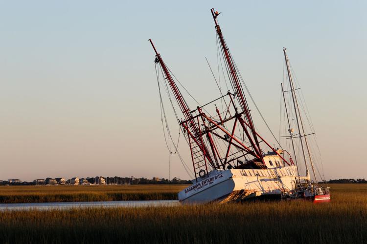 SC's weekend high tides help to float a long-stuck shrimp boat out of marsh