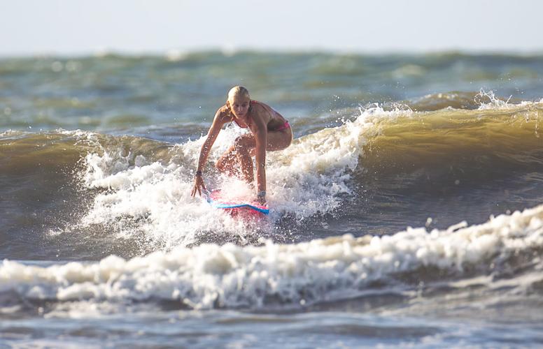 Surfers prepare for the Folly Beach Wahine Classic