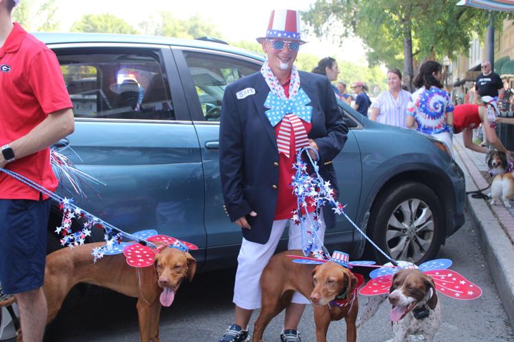 Patriotic dogs stroll downtown Aiken for parade
