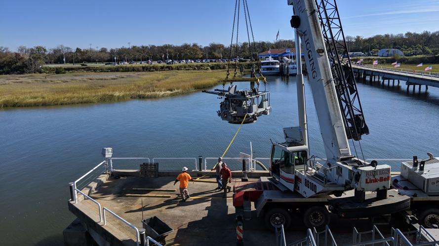 Patriots Point team moved a quad 40 MM gun onto pier leading to U.S.S ...