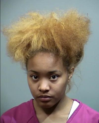 Warrant: woman helped murder suspect avoid police