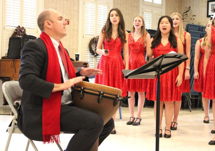 Churning out the Christmas cheer: Wando Show Choir performs at Rotary ...