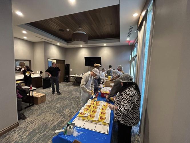 Summerville Rotary Club packs meals for students