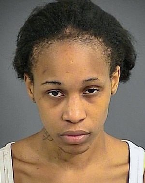 Woman admits role in child's death