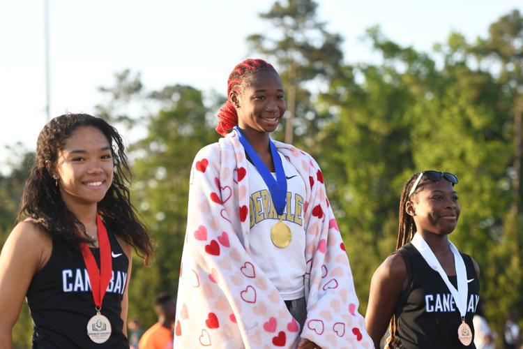 Track and field athletes claim county titles