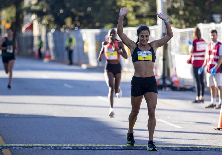 Cheserek, Rojas win 'emotional', long-delayed Cooper River Bridge Run