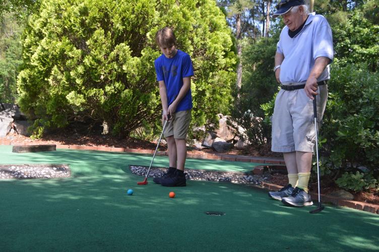 Putt-putting away boredom: Aiken entertainment venue reopens for ...