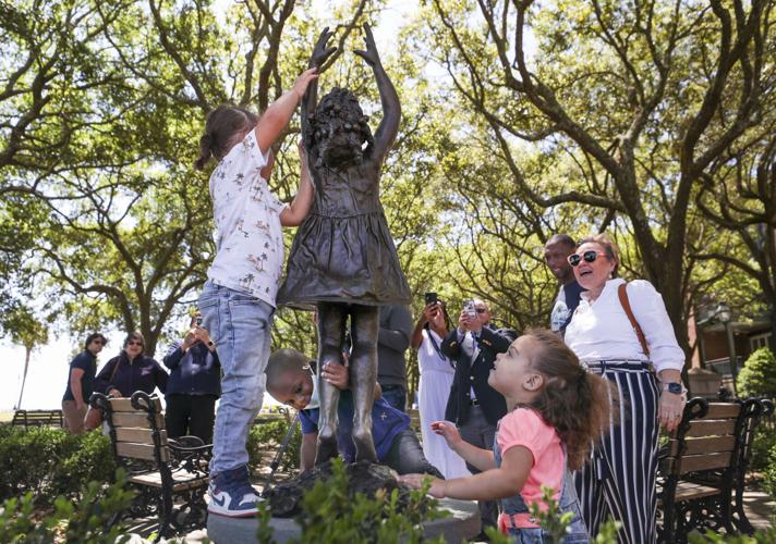 Photos: Dedication of "Lilly" statue donated by artist Mary Whyte ...