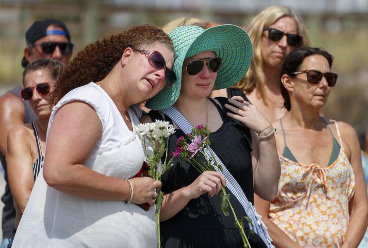 Photos: Hundreds gather at beachside vigil for Samantha Miller