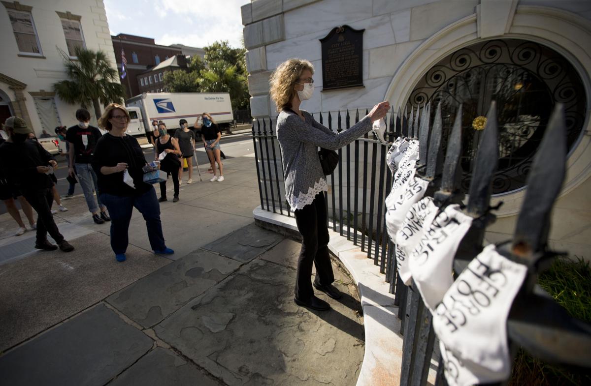 Peaceful Charleston protesters march around Colonial Lake, take a knee ...