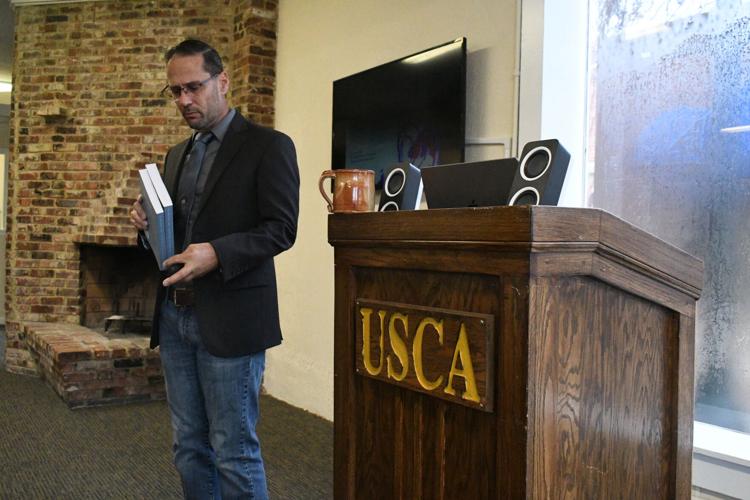 Art historian lectures about video loops, relevance to today