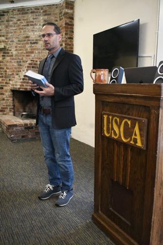 Art historian lectures about video loops, relevance to today