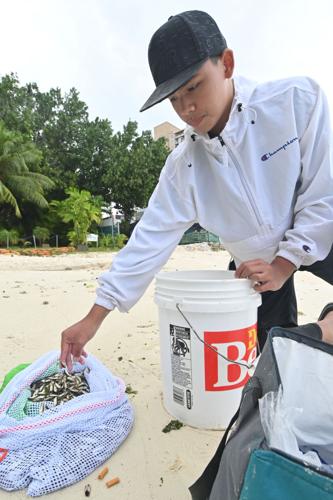 Fishing for mañåhak in Tumon Bay | Local News | postguam.com