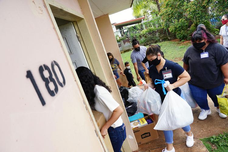 Serve Guam Commission, AmeriCorps aid family in need after house fire ...