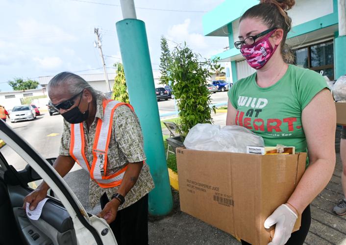 Hundreds line up for food | Local News | postguam.com