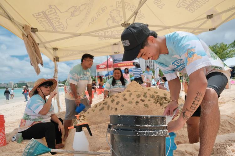 Sculptors bring beach to life in SandFest | Local News | postguam.com