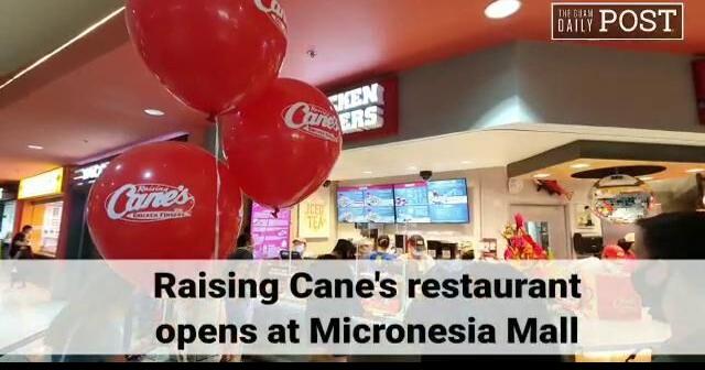 Customers line up for the grand opening of Raising Cane's at Micronesia ...