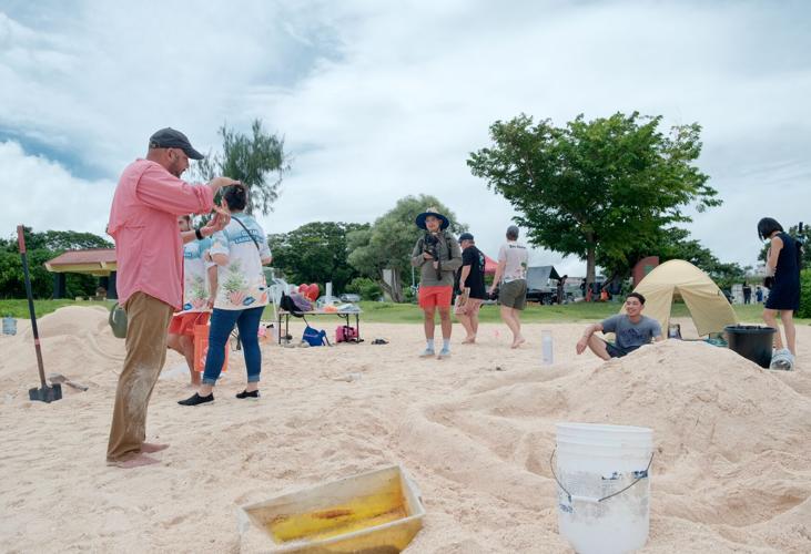 Sculptors bring beach to life in SandFest | Local News | postguam.com