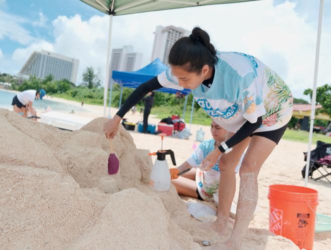 Sculptors bring beach to life in SandFest | Local News | postguam.com