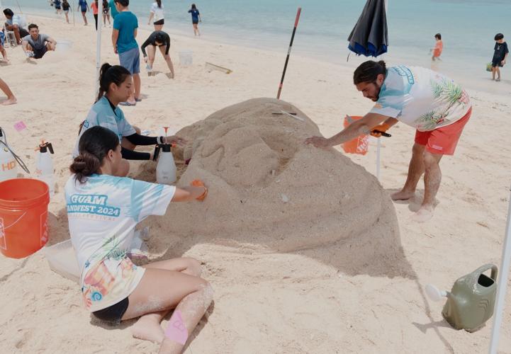 Sculptors bring beach to life in SandFest | Local News | postguam.com