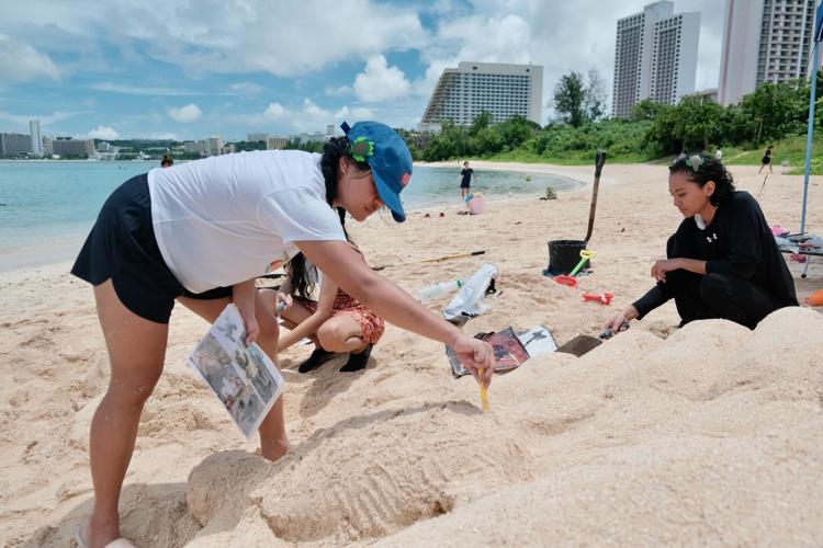 Sculptors bring beach to life in SandFest | Local News | postguam.com