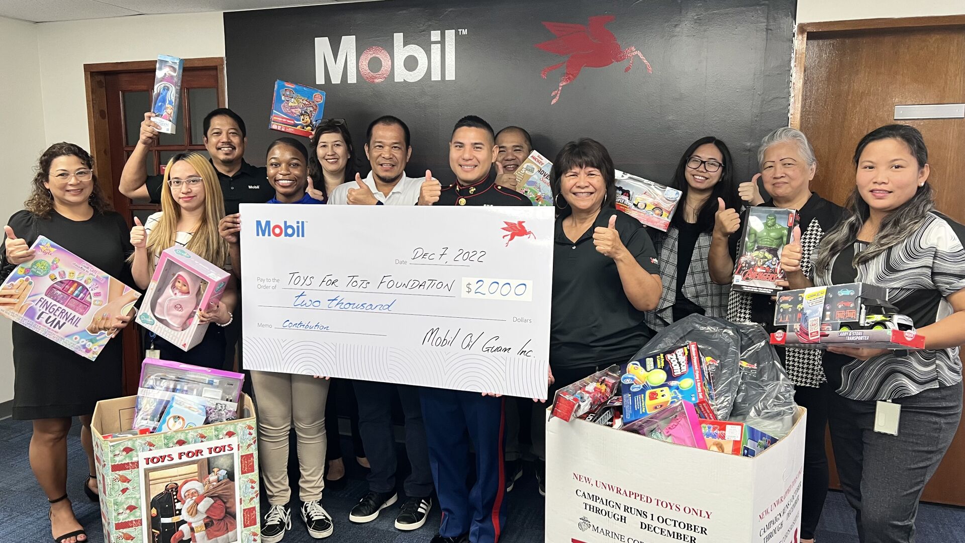 Mobil donates presents, $2K to brighten holidays for kids | Local News ...