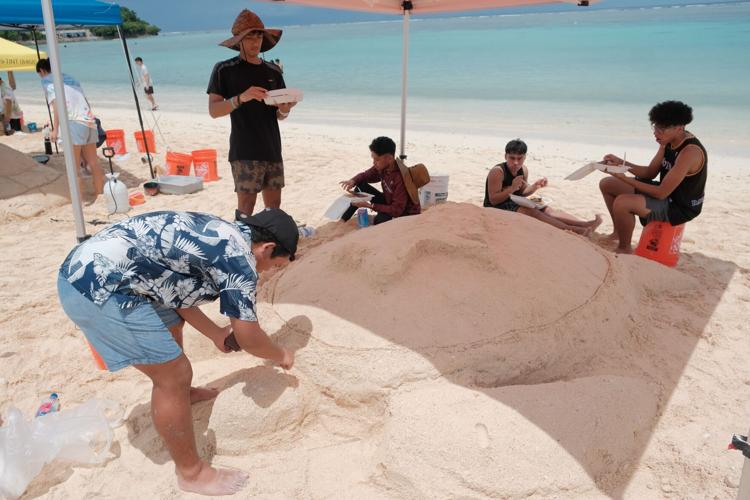 Sculptors bring beach to life in SandFest | Local News | postguam.com