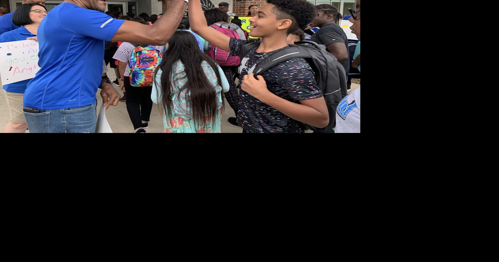 PHOTOS: Welcome back! Volunteers greet Rippon Middle School students on ...