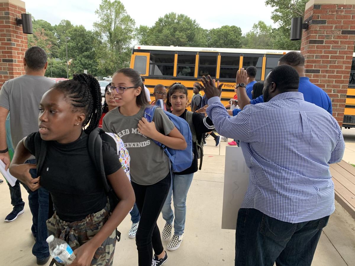 PHOTOS: Welcome back! Volunteers greet Rippon Middle School students on ...