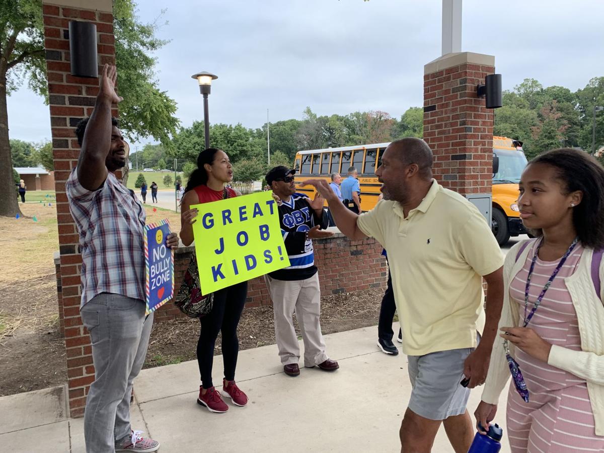 PHOTOS: Welcome back! Volunteers greet Rippon Middle School students on ...