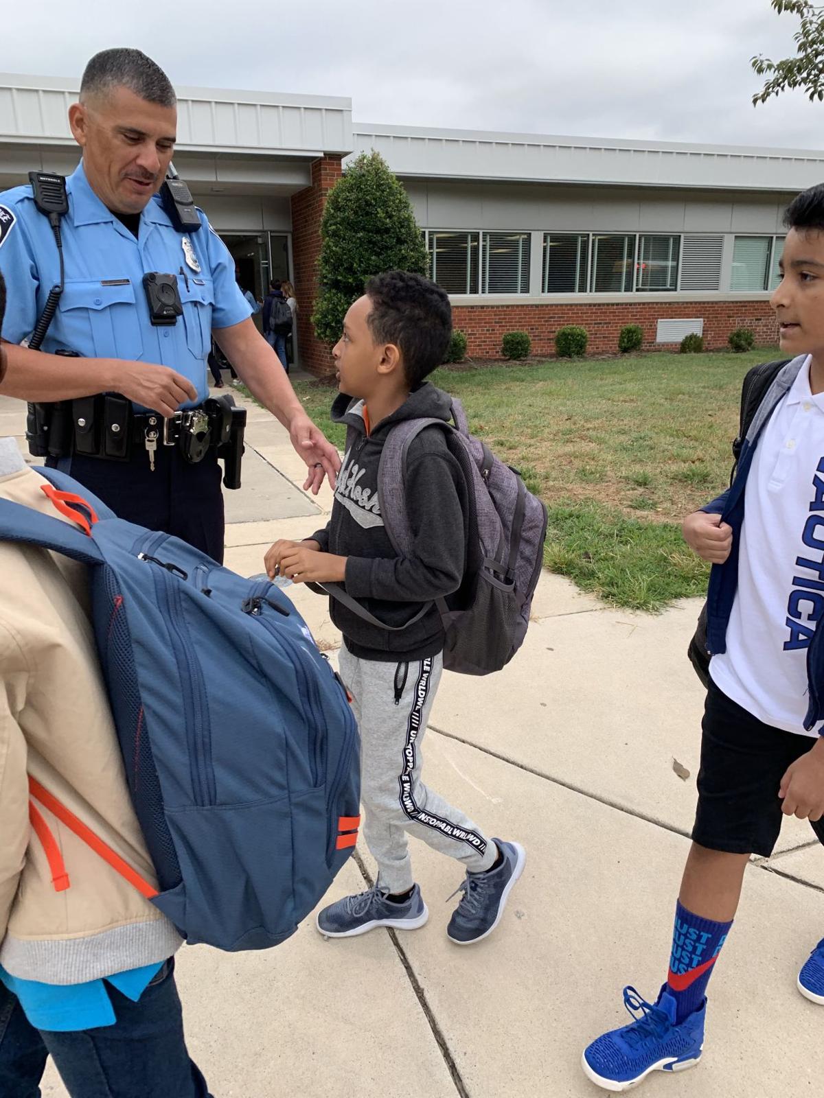 PHOTOS: Welcome back! Volunteers greet Rippon Middle School students on ...