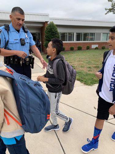 PHOTOS: Welcome back! Volunteers greet Rippon Middle School students on ...
