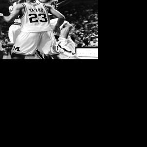 Photo: Ryan Bayley driving to the basket against Michigan at the Jordan ...