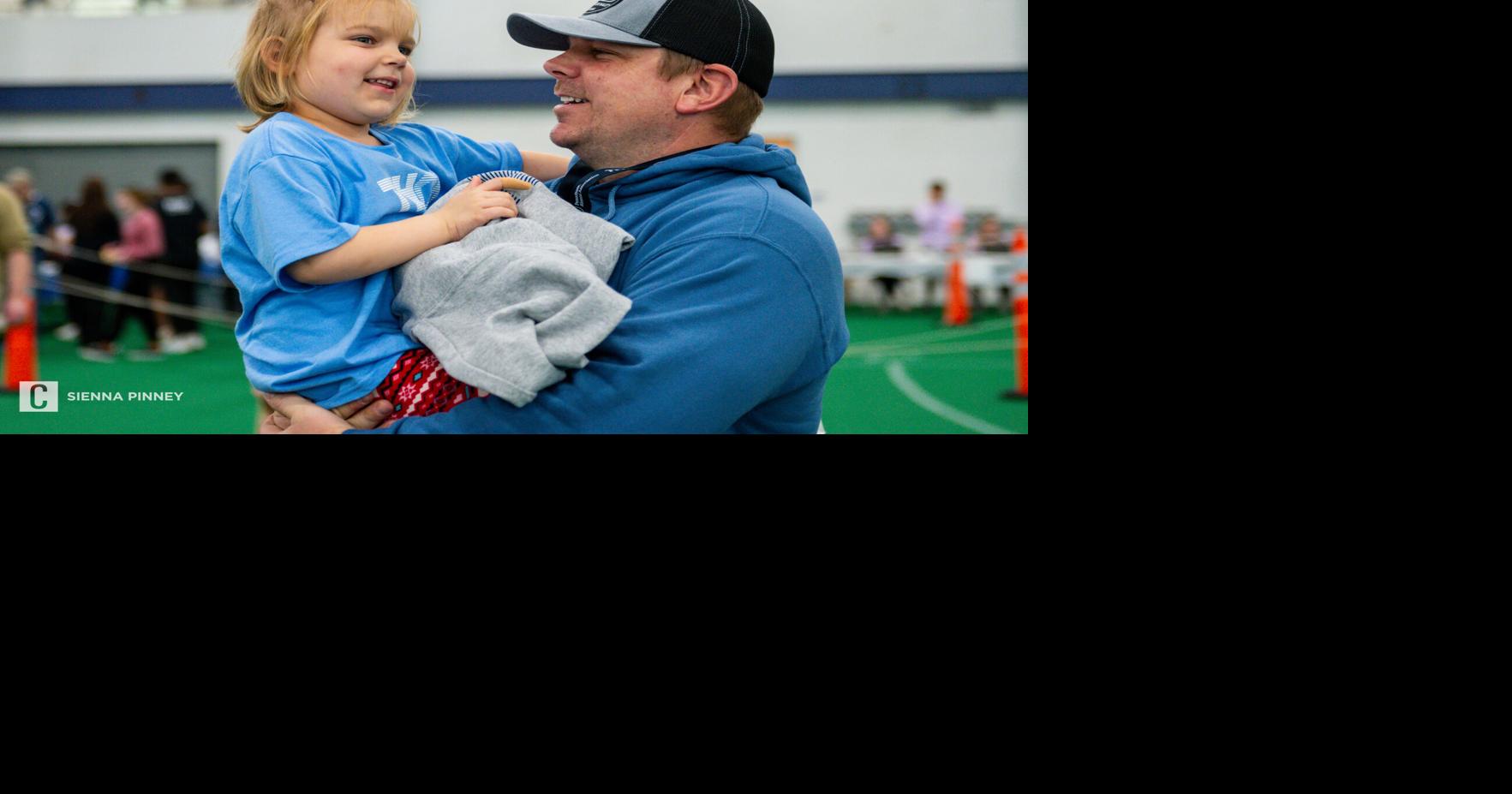 THON Family Carnival, Dad holding daughter | | psucollegian.com