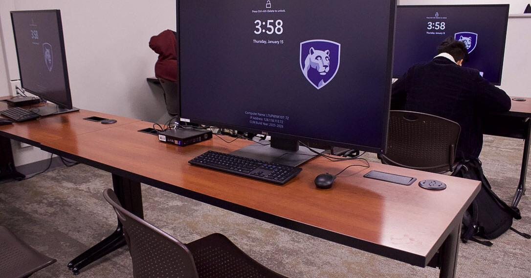 PSU Computers, large monitor with people behind them | | psucollegian.com
