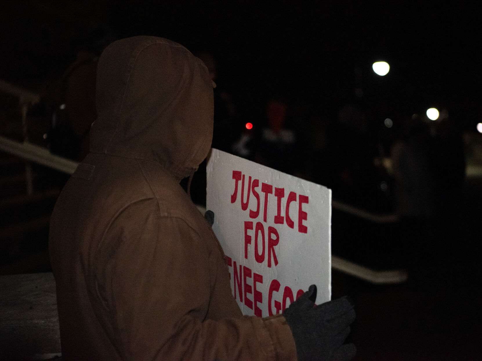 1/12 ICE Protest, Man holds sign | | psucollegian.com