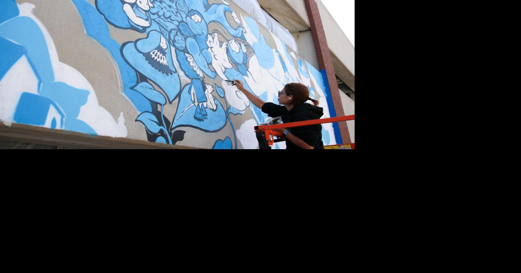 Artist Bao Ho paints fairy tale inspired mural on West Lafayette ...