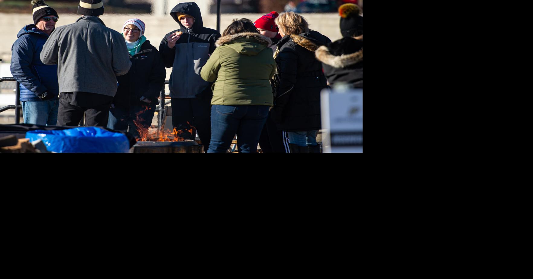 11/19/22 Fans and Tailgating, Tailgaters crowd around fire | Campus ...