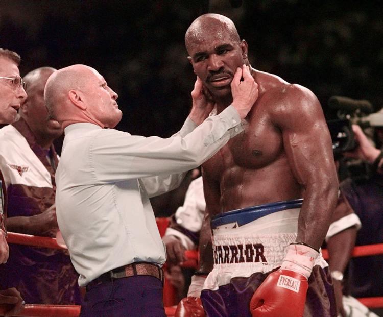 Today in sports history: Evander Holyfield wins after bitten on ear by ...