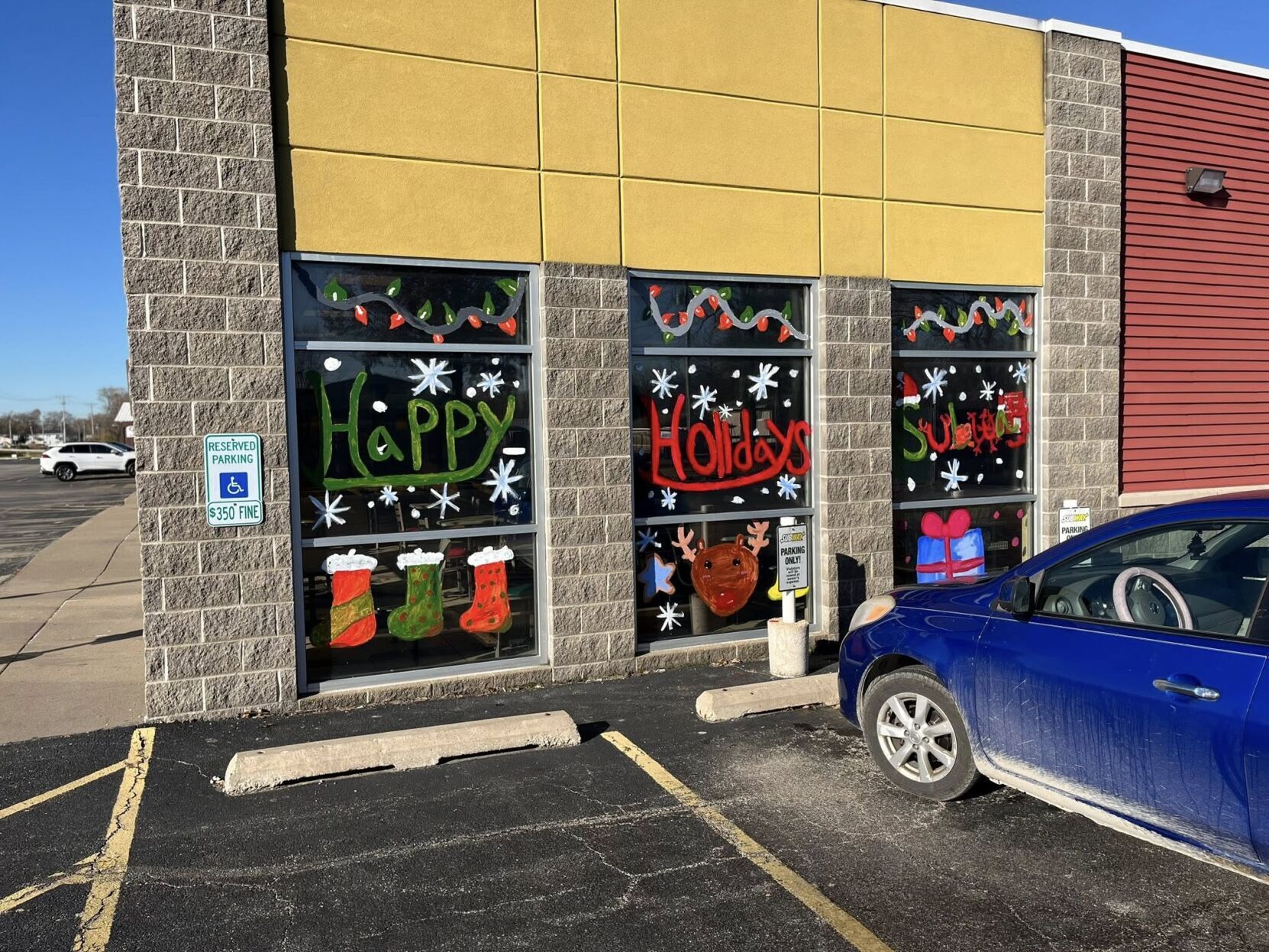 Sherrard High School students start window painting project