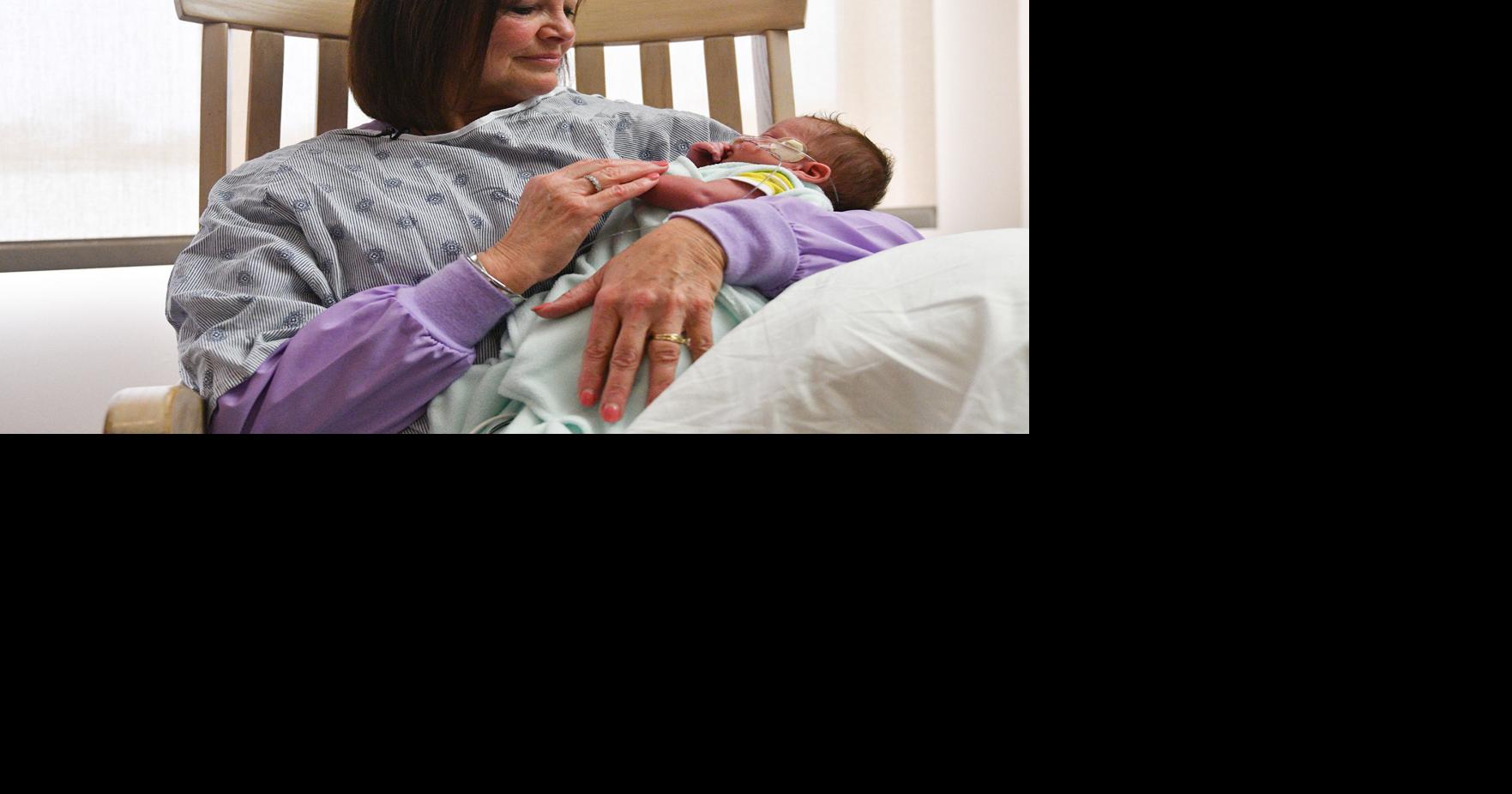 'It's a rewarding job to have': Baby cuddling program benefits ...