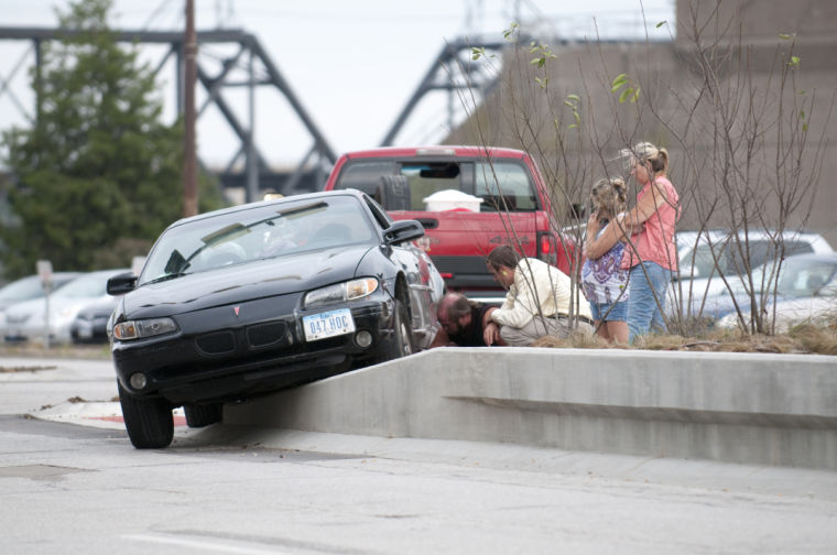 Car gets stuck on median