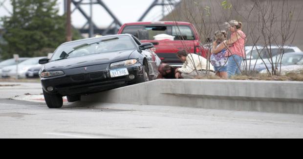 Car gets stuck on median