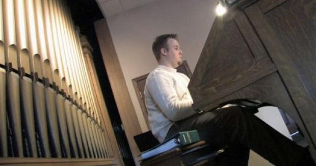 Young organist plays at church and ballpark